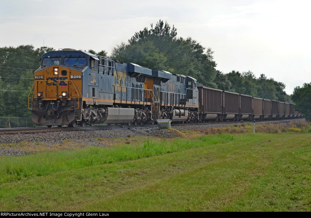 CSX 702 leads a "2 coal trains" combined into 1 east out of town, if I remember correctly it had ...